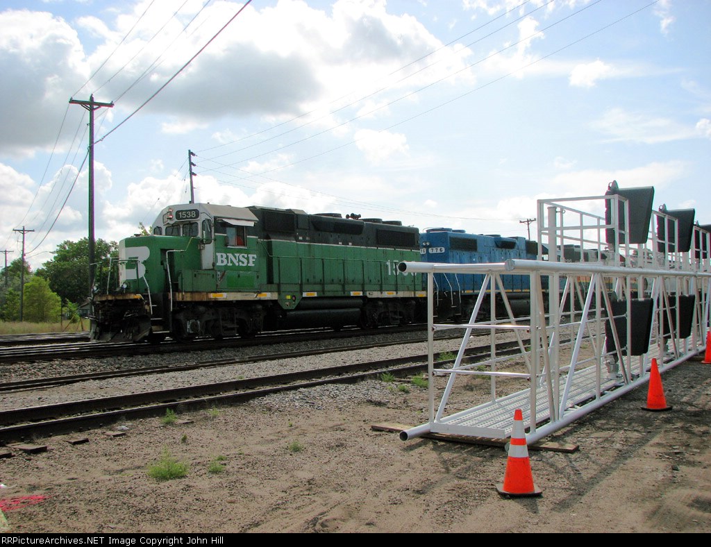 090731019 Inbound BNSF freight passes CTC University as it preprares to enter Northtown Yard.